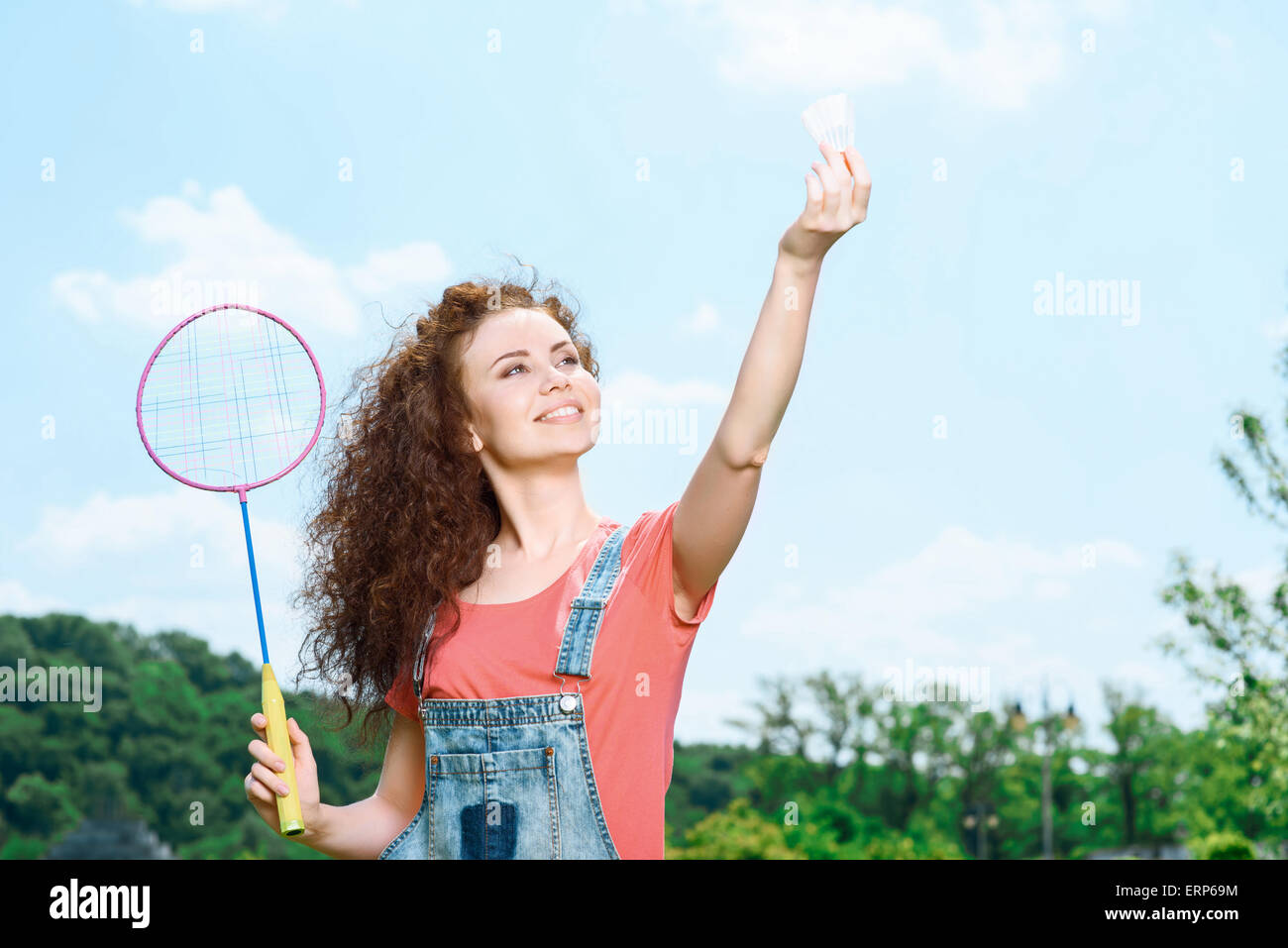 Happy family playing badminton Stock Photo - Alamy