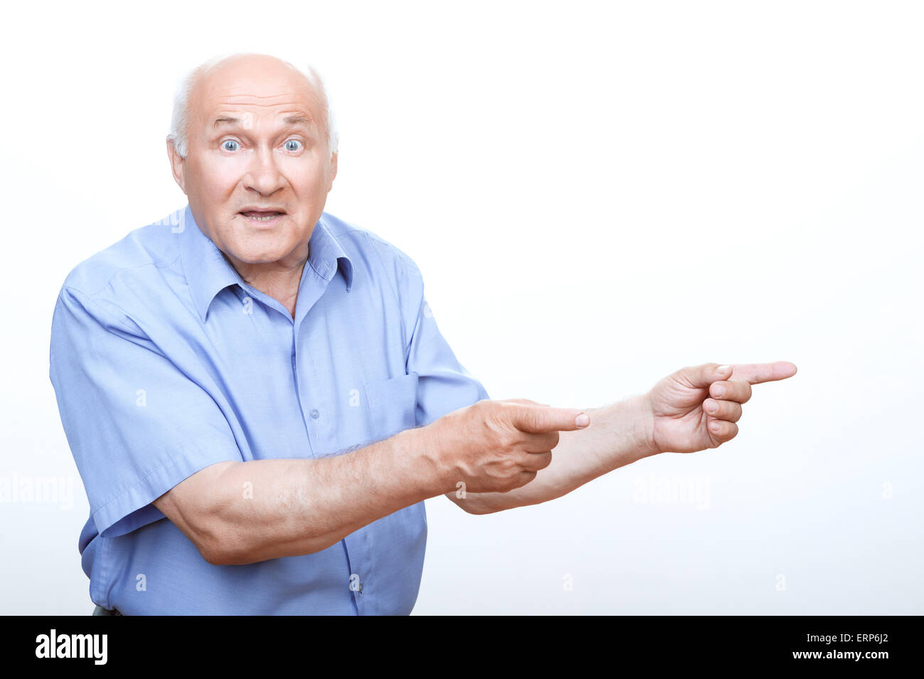 Astonished grandfather pointing to the left Stock Photo - Alamy