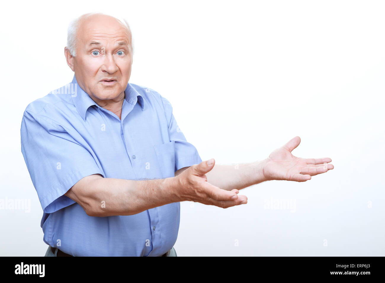 Confused grandfather holding hands up Stock Photo - Alamy