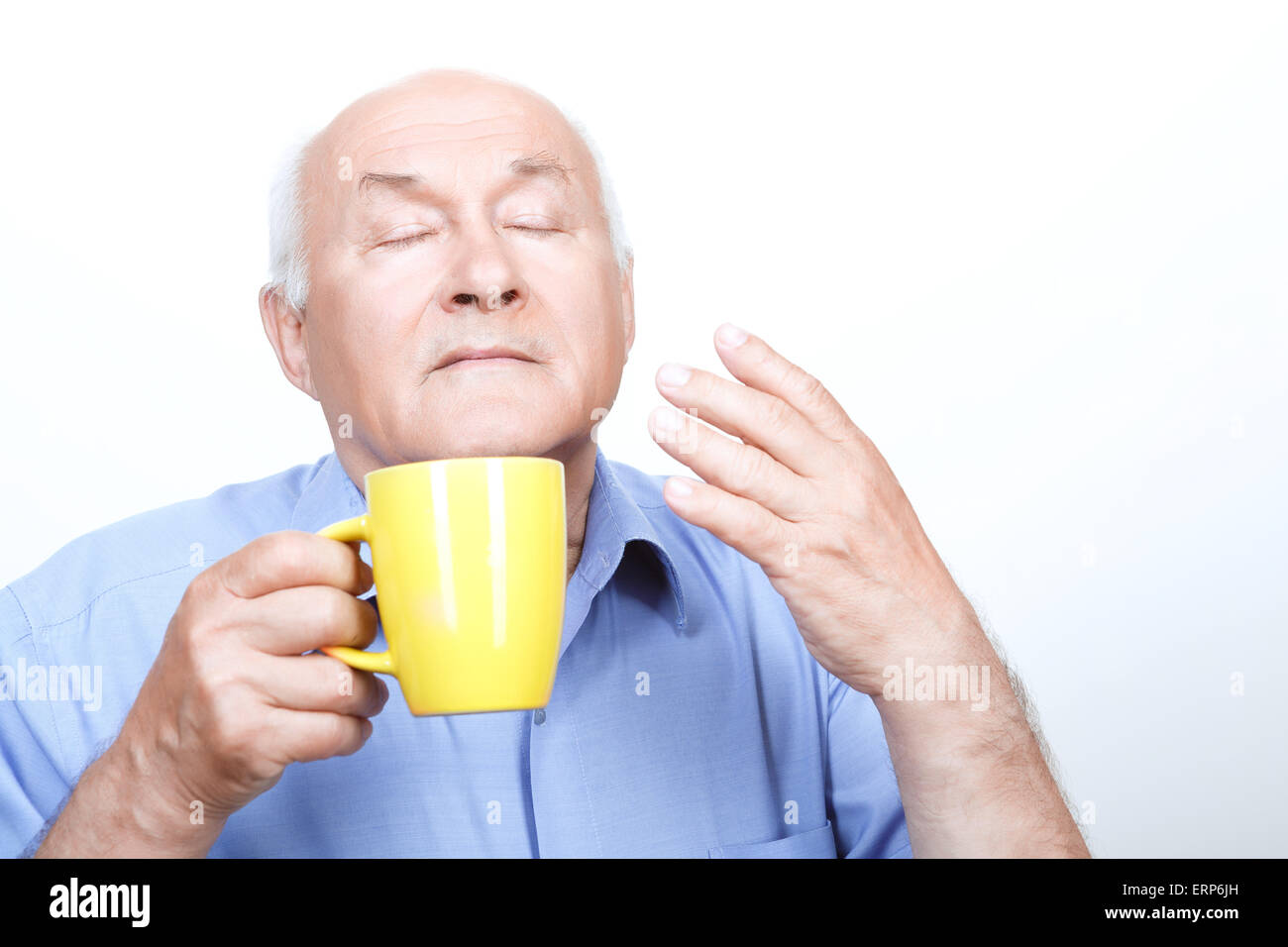 Nice grandfather smelling tea aroma Stock Photo - Alamy