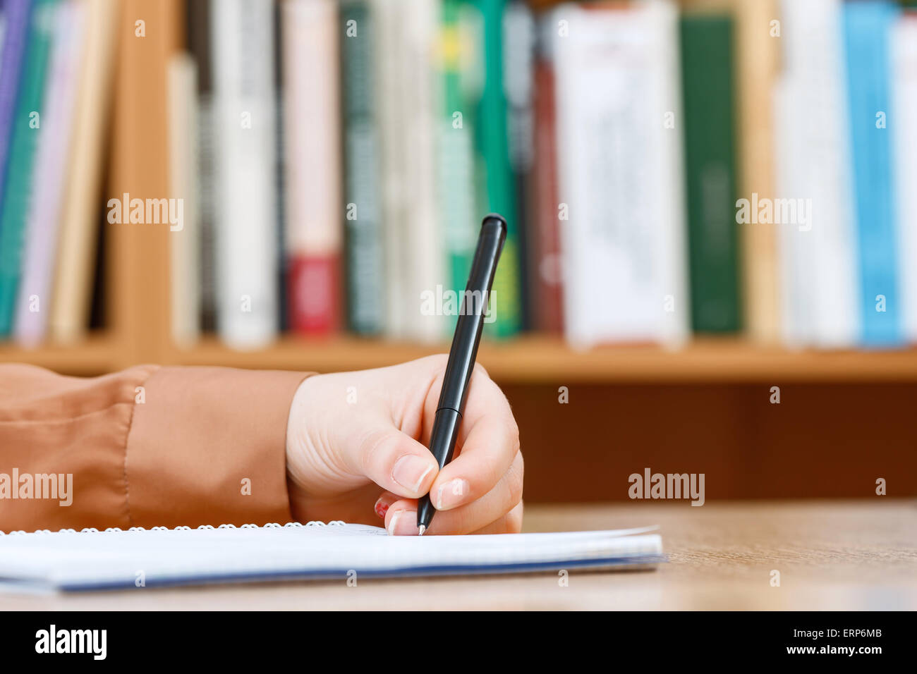 Woman hands in a library Stock Photo - Alamy