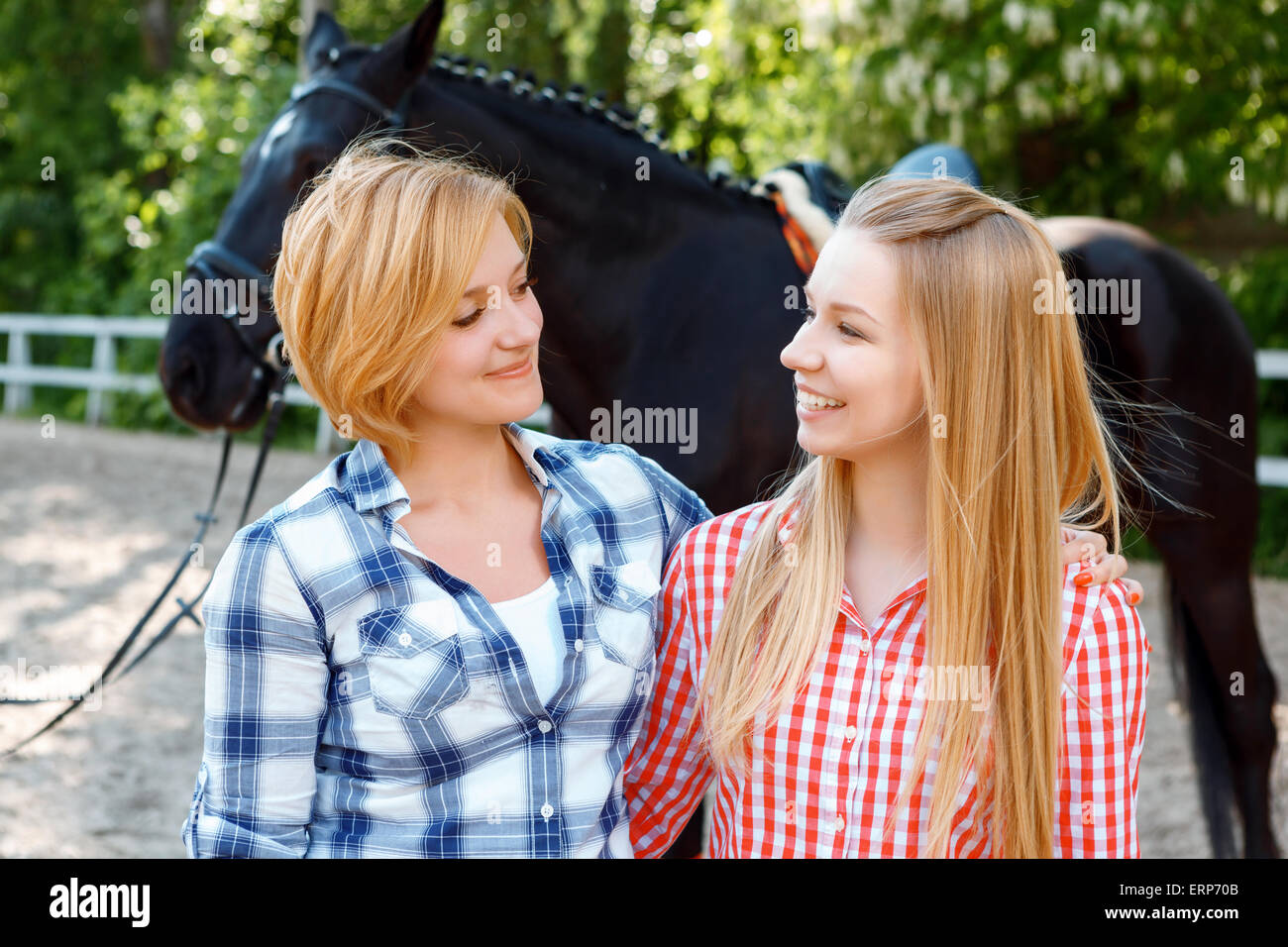 Smiling sister embracing with each other Stock Photo - Alamy