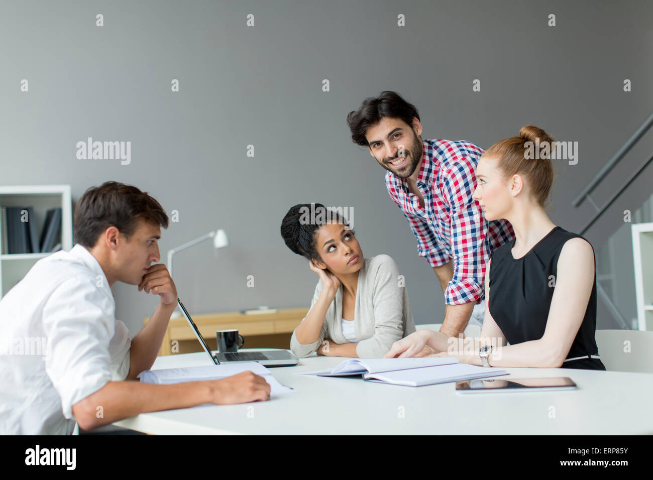 Young people in the office Stock Photo - Alamy