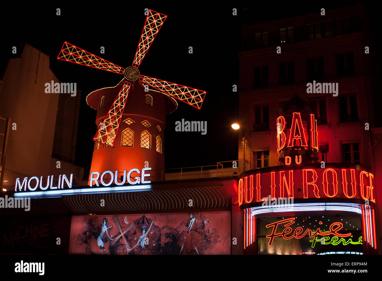 Red mill of famous Moulin Rouge cabaret & night club in Paris by night ...