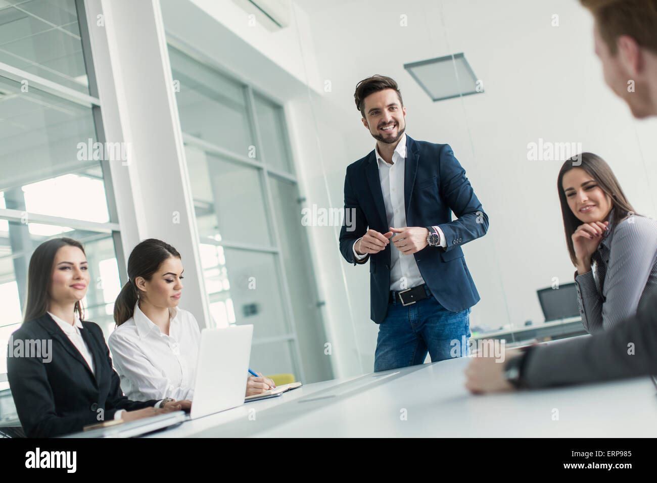 Young people in the office Stock Photo - Alamy