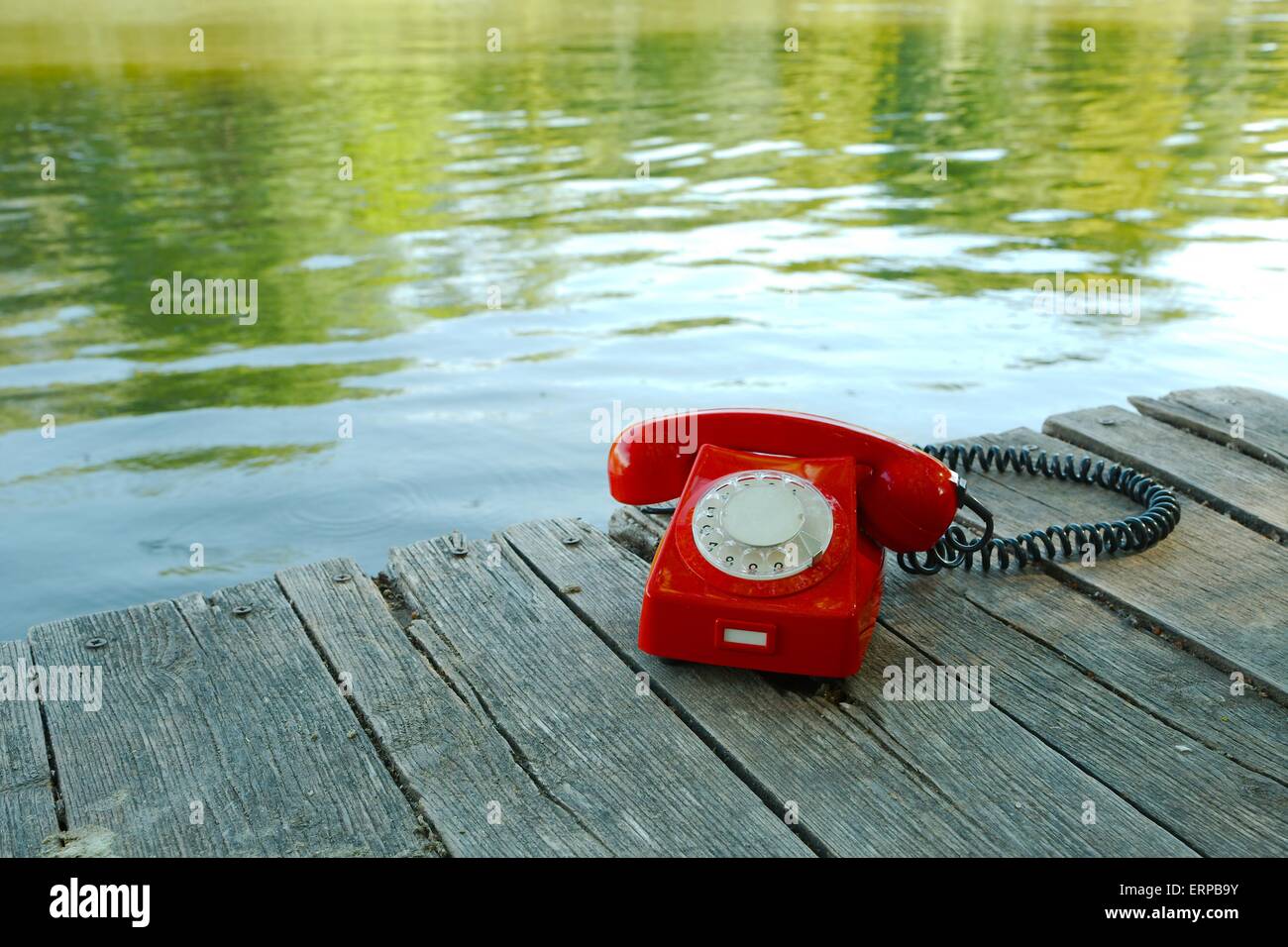 Old telephone in nature Stock Photo - Alamy