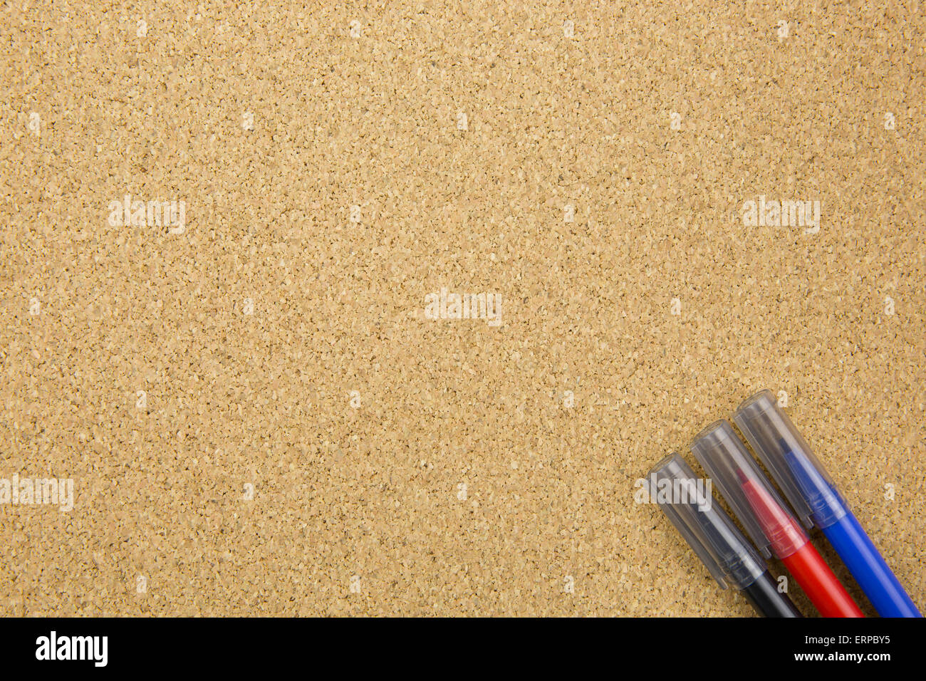 three color marker on cork board Stock Photo - Alamy