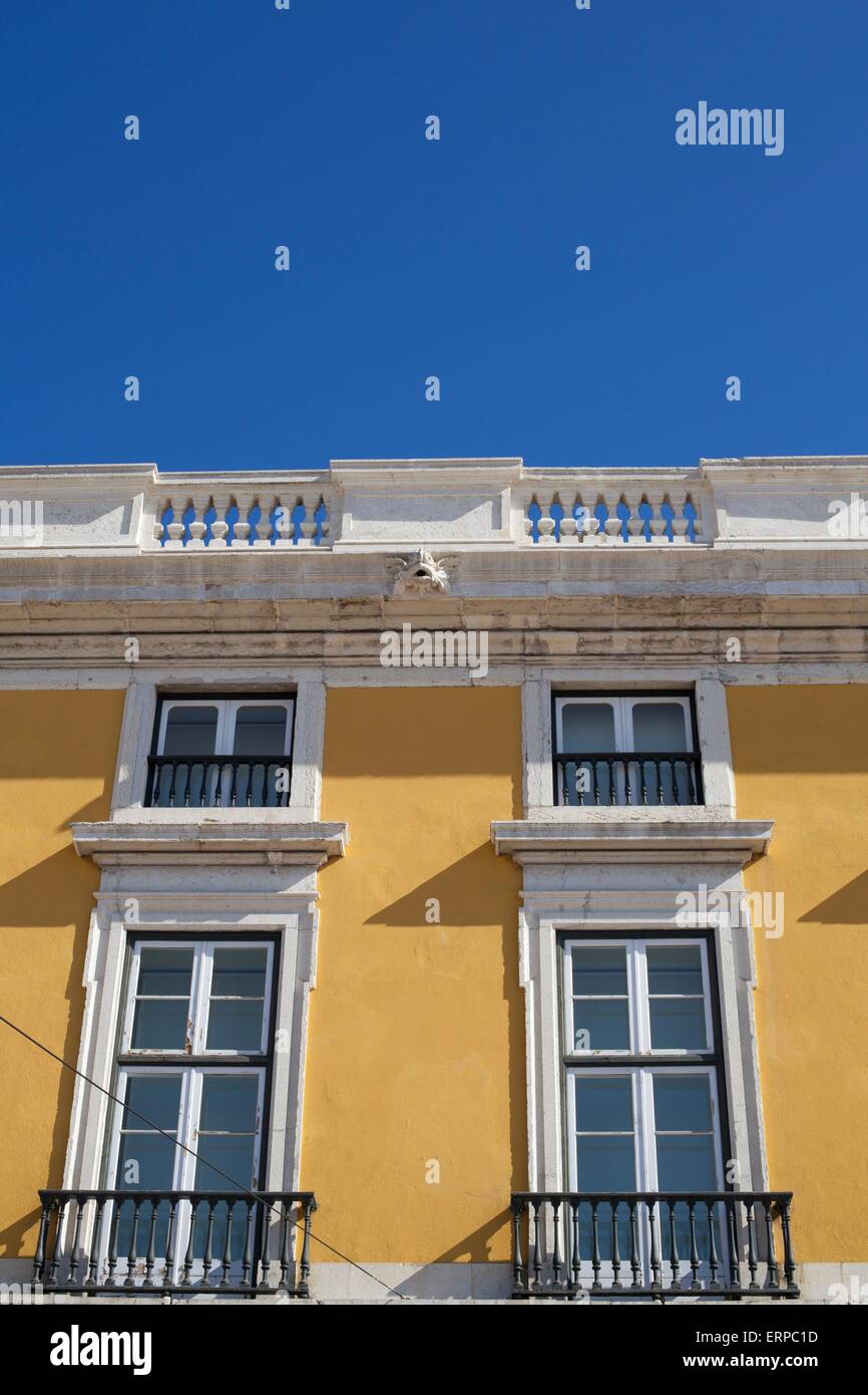 Colourful buildings in Praca de Comercio of Lisbon against a bright ...