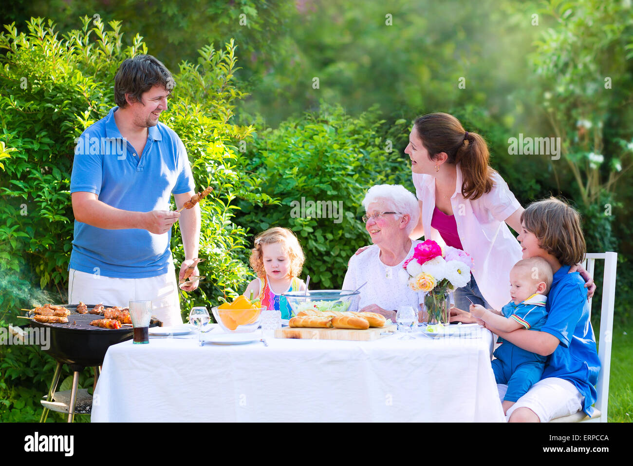 Father son enjoying backyard bbq hi-res stock photography and images ...