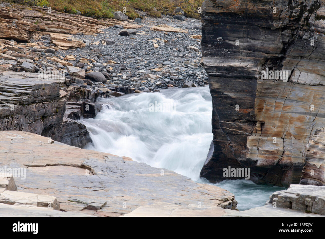 Short river and rapid up North. Canyon with rocks, cliffs and water in ...