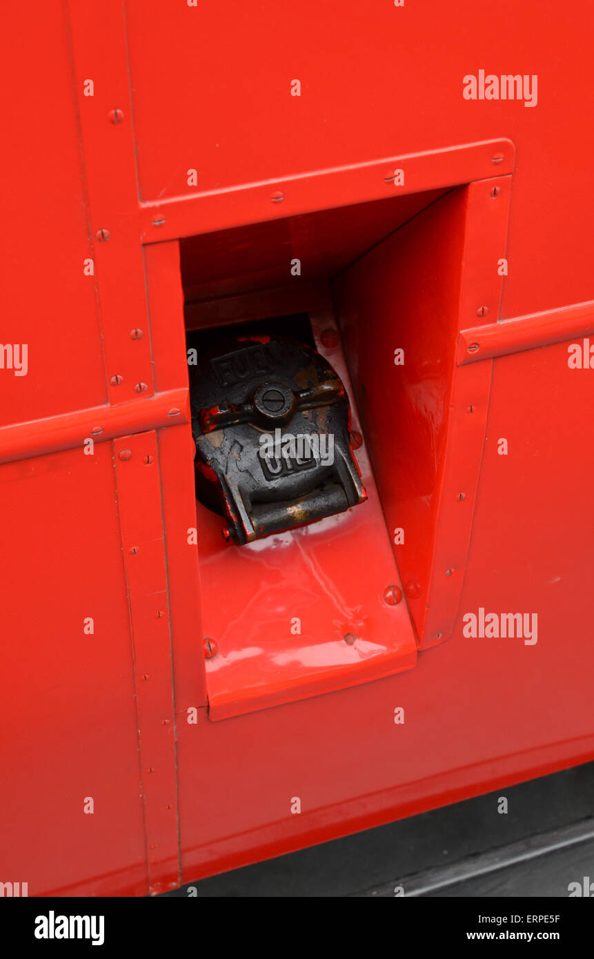 Vintage black painted metal diesel oil fuel filler cap on a commercial ...