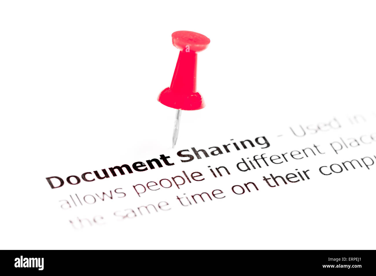 Words DOCUMENT SHARING pinned on white paper with red pushpin ...