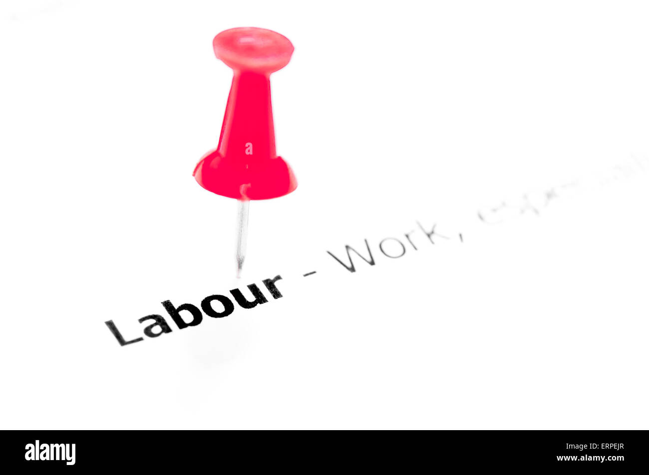 Word LABOUR pinned on white paper with red pushpin, available copy ...