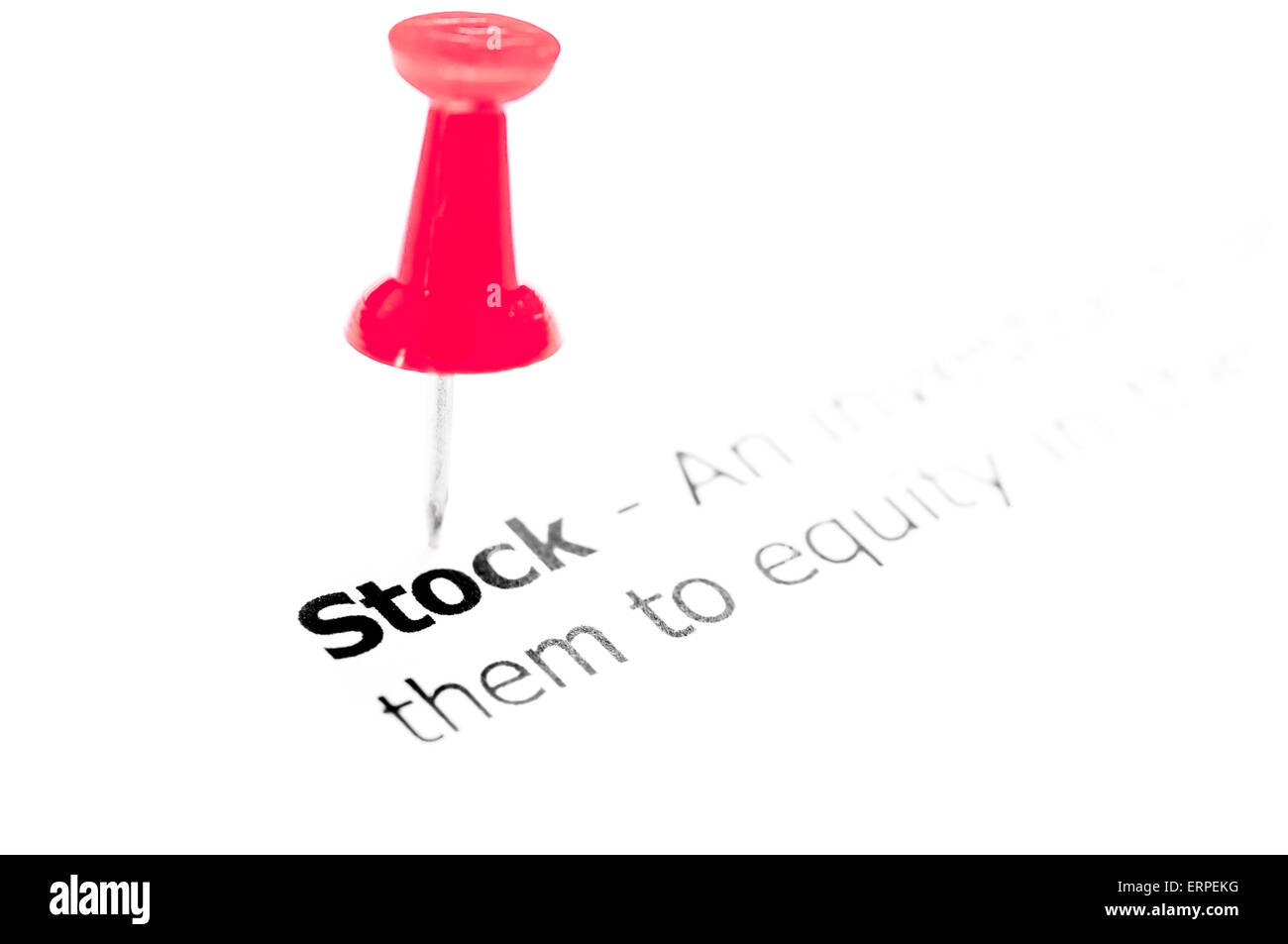 Word STOCK pinned on white paper with red pushpin, available copy space ...