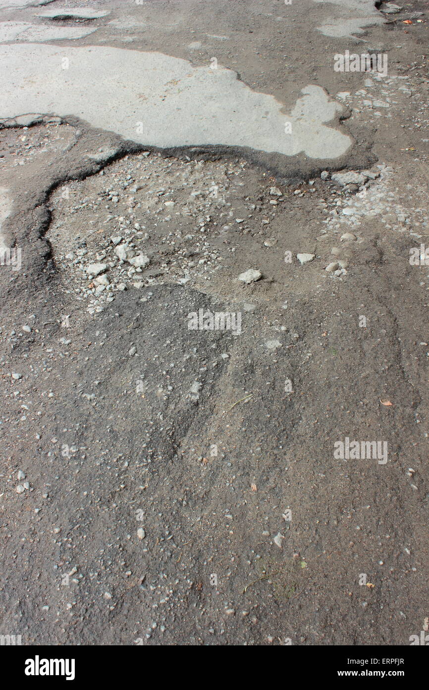part of the old carriageway road with holes on the pavement Stock Photo ...
