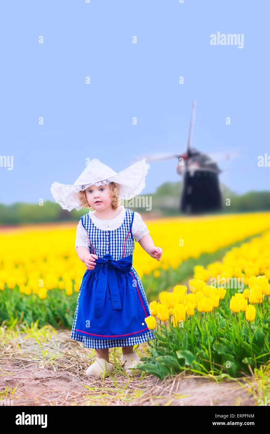 Toddler girl wearing Dutch traditional national costume dress and hat ...