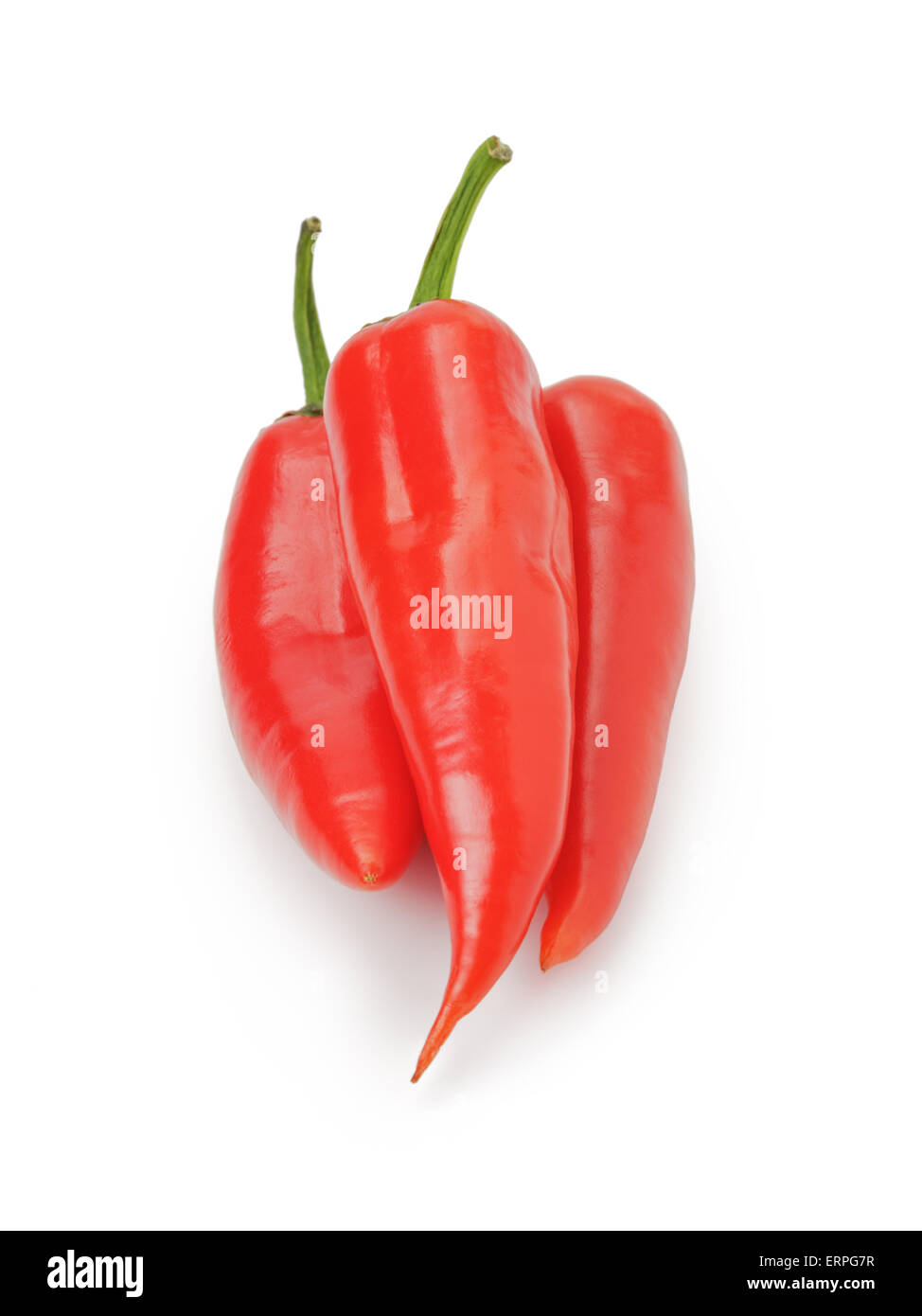 three whole red chili peppers on white Stock Photo - Alamy