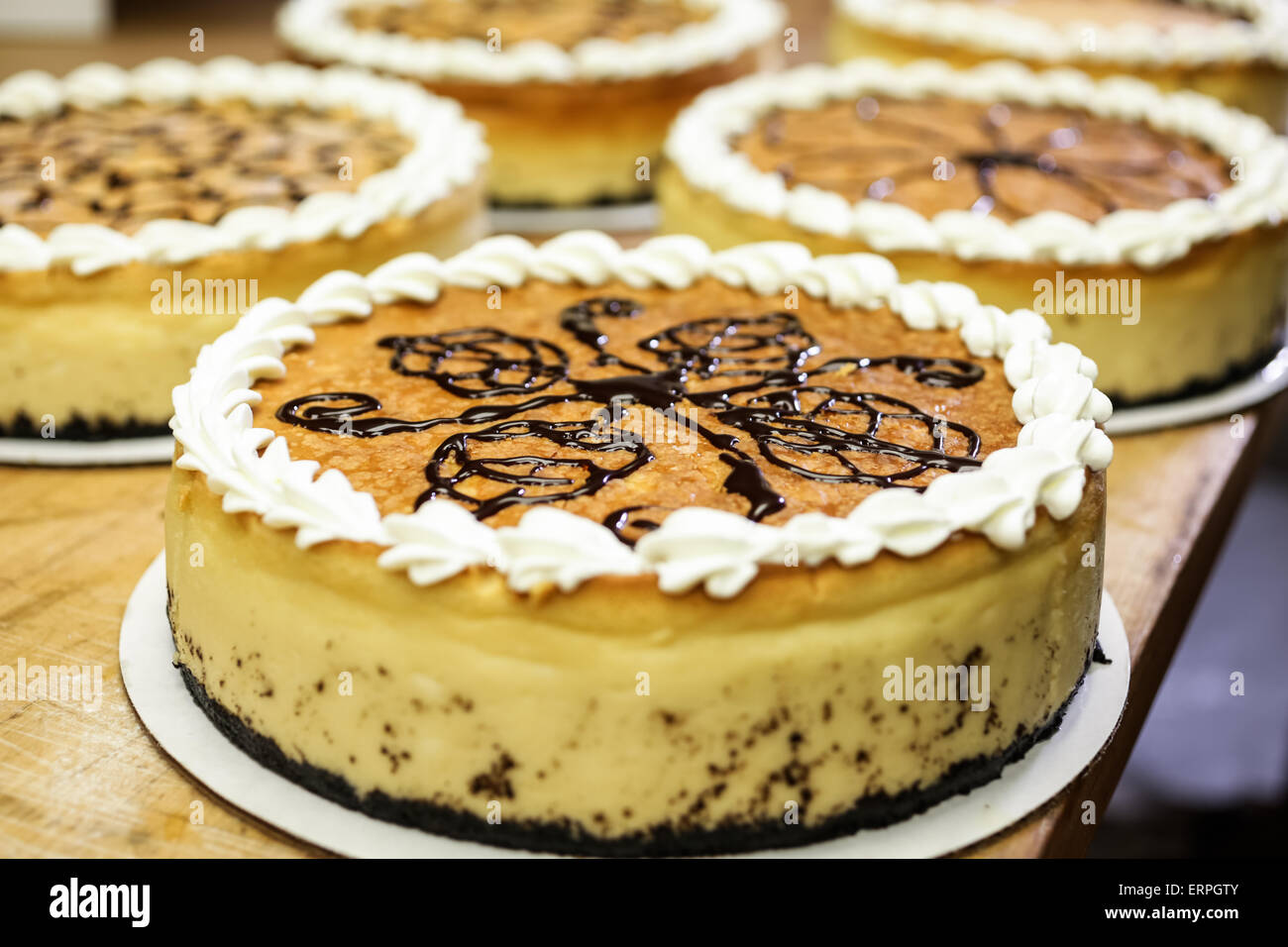 Cheesecakes prepared in the kitchen of Italian restaurant Stock Photo ...
