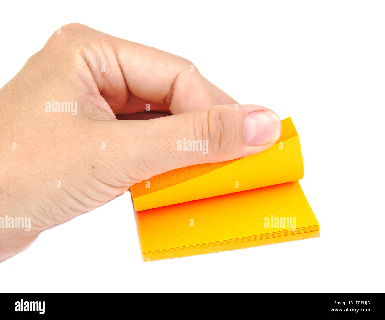 Hand with a block of yellow post it notes or notepapers on white ...