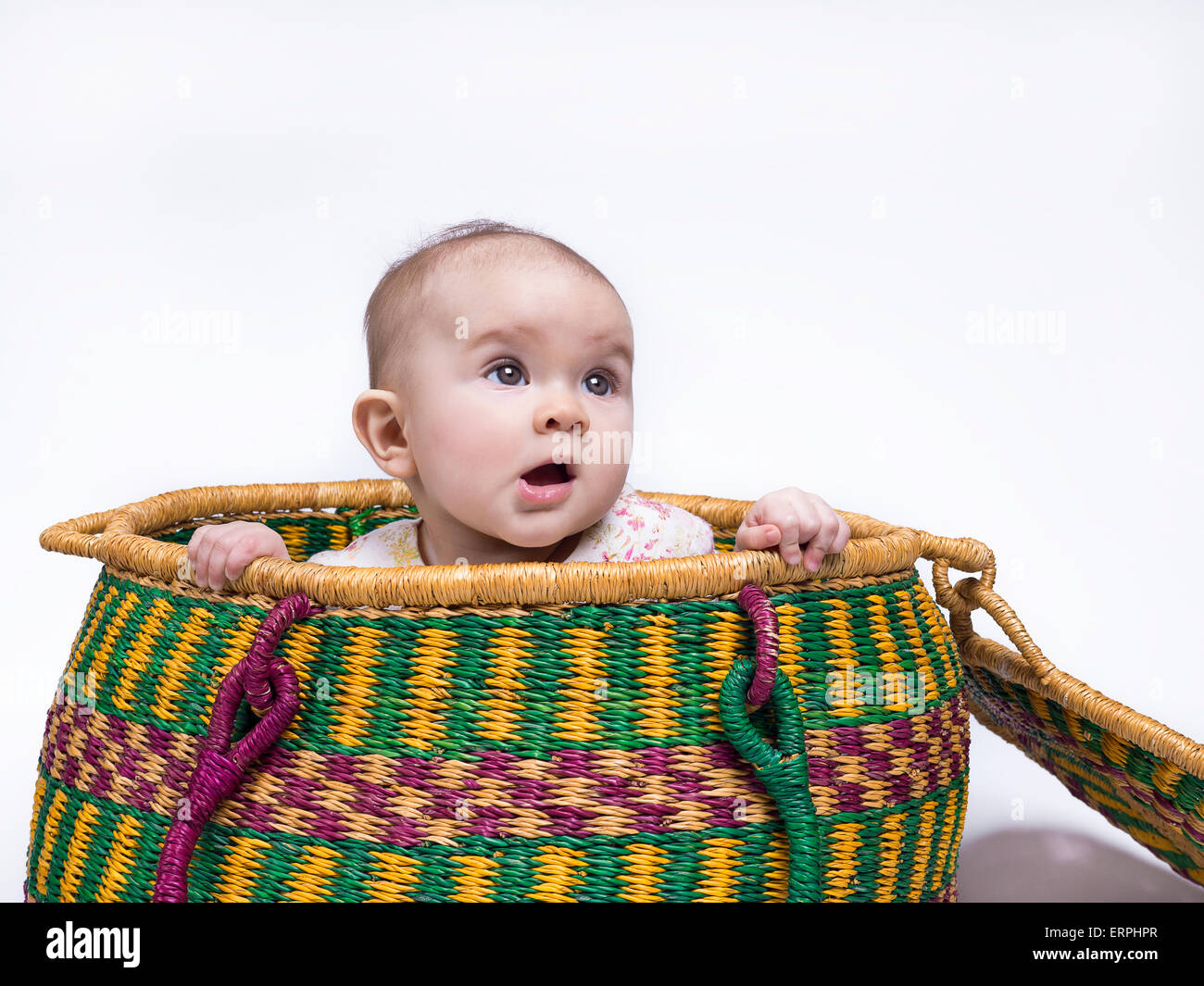 cute baby hiding in a basket Stock Photo - Alamy