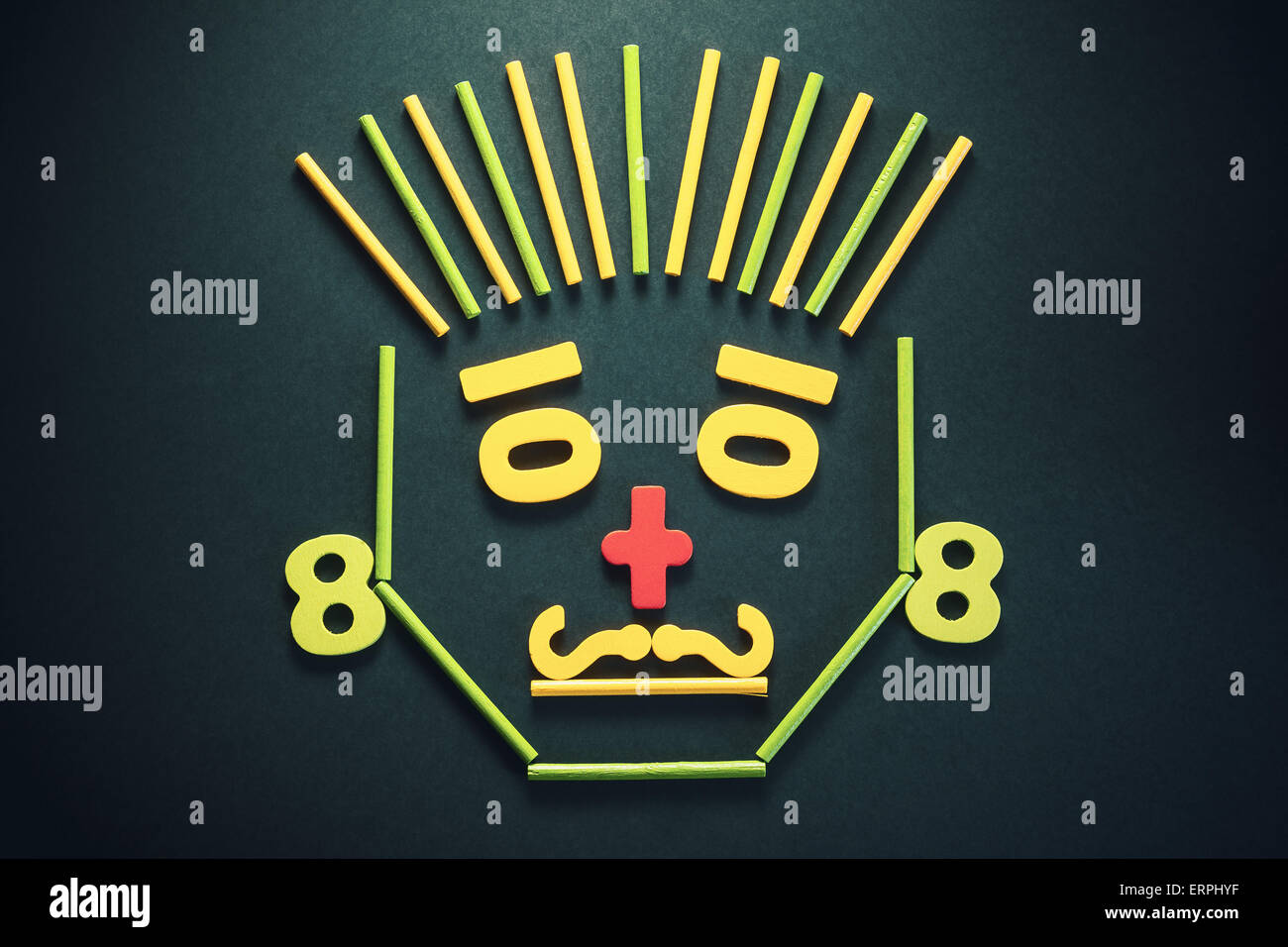 Child's play, face made of toys, wooden sticks and numbers Stock Photo ...