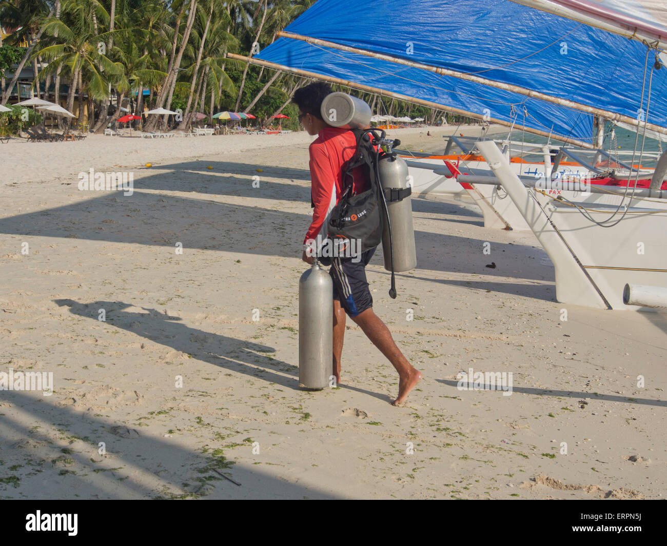 Diving instructor with tanks on beach in Boracay, Philippines Stock ...