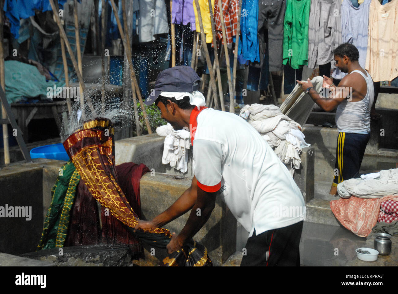 Men washing clothes at Mahalaxmi Dhobi Ghat open air laundromat, Mumbai ...