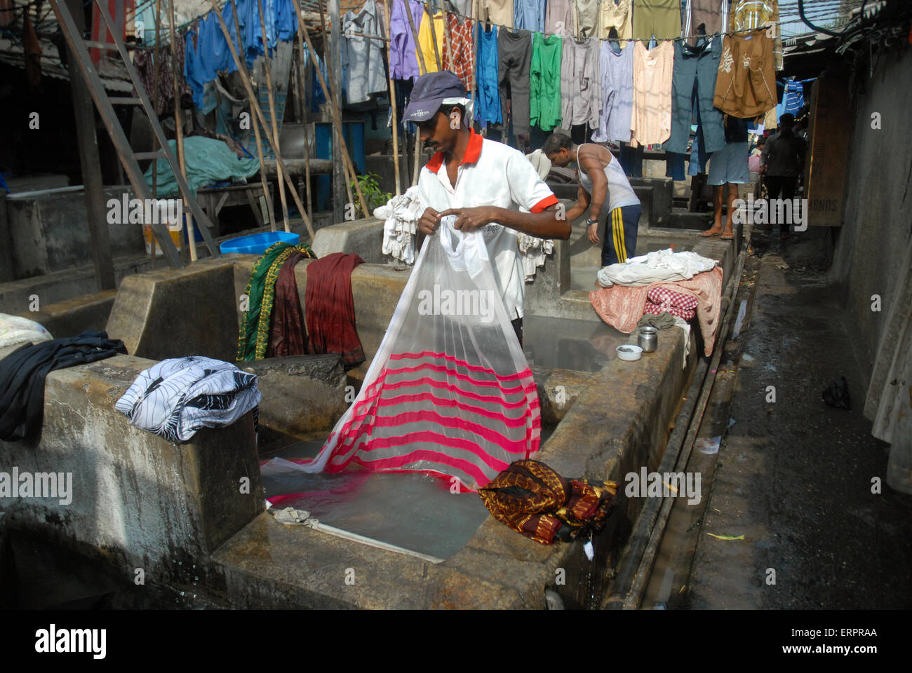 Men washing clothes at Mahalaxmi Dhobi Ghat open air laundromat, Mumbai ...