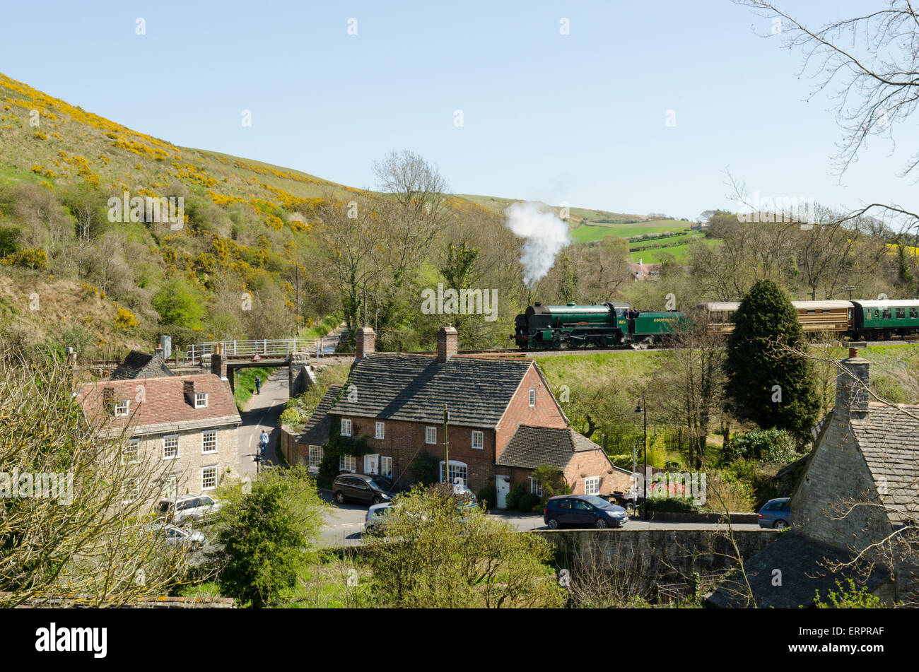 Steam train crossing railway bridge in Corfe, Dorset, April, pulling ...