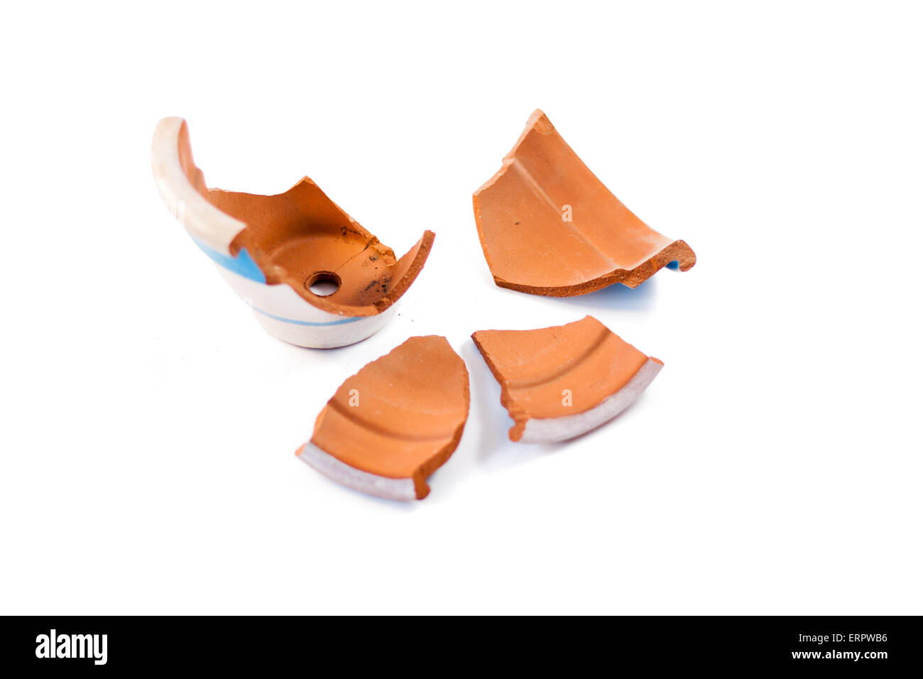 Fragments of broken ceramic flower pot. Soft focus on edges. Isolated ...