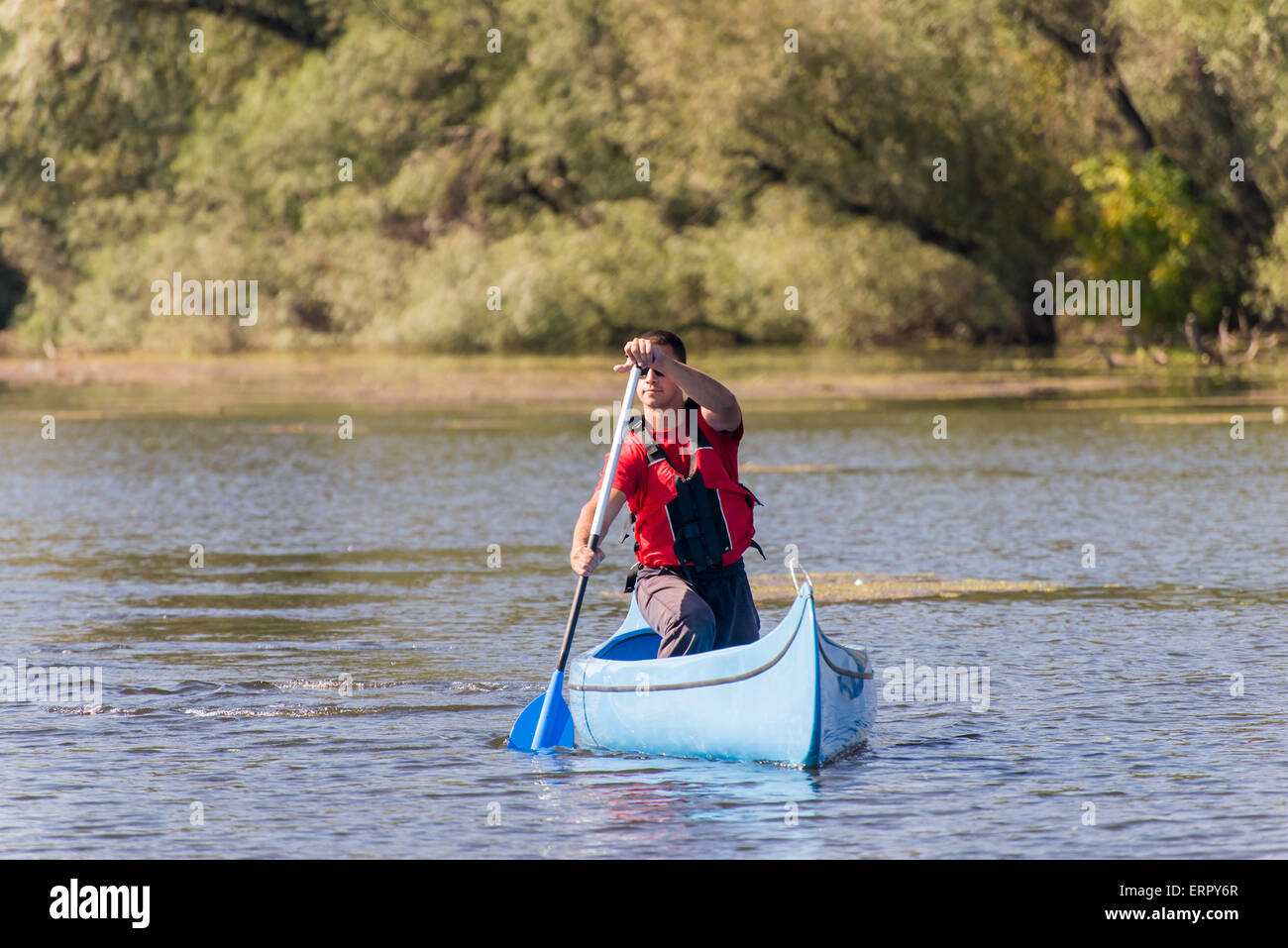 Young man in canoe Stock Photo - Alamy