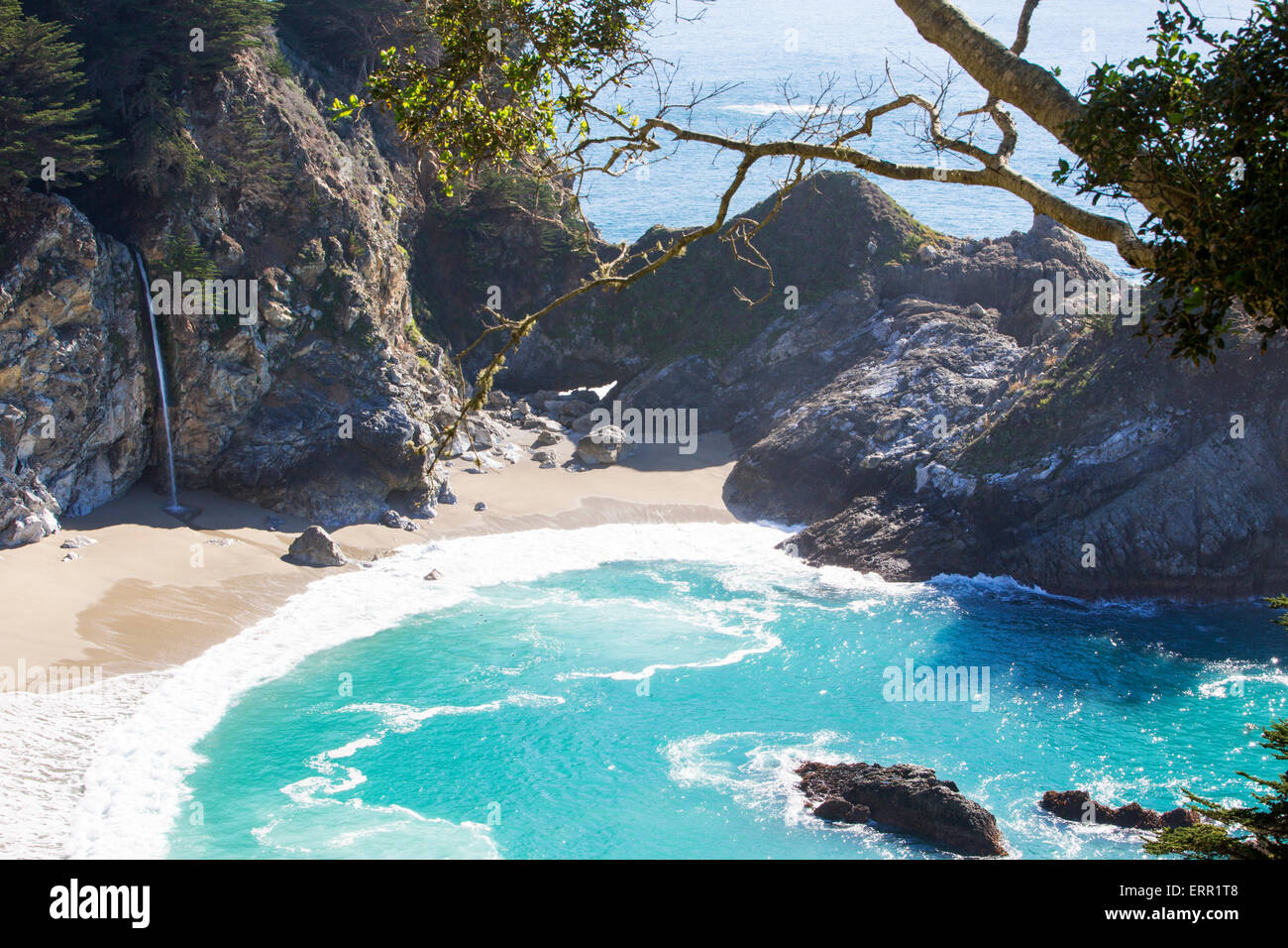 beautiful McWay falls in Big Sur California with sandy beach and blue ...