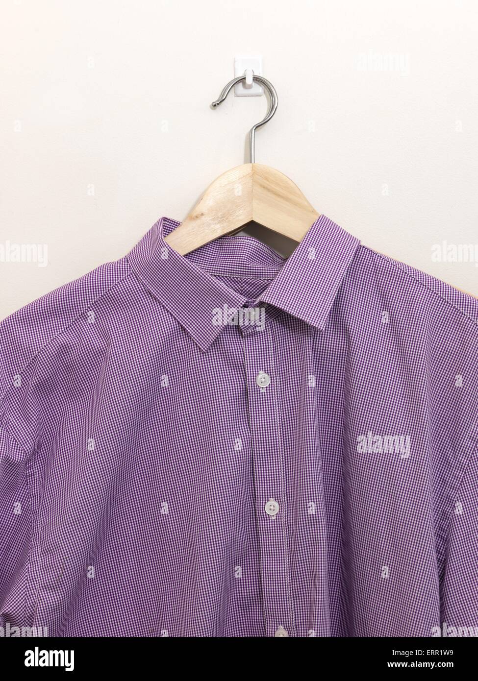 A close up shot of clothes hanging on a hook Stock Photo - Alamy