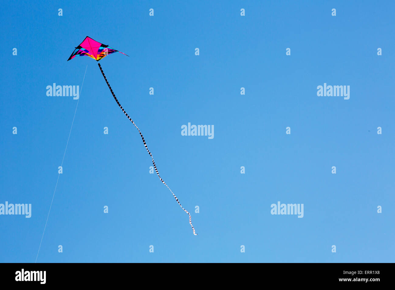 colorful kite in the blue sky Stock Photo - Alamy