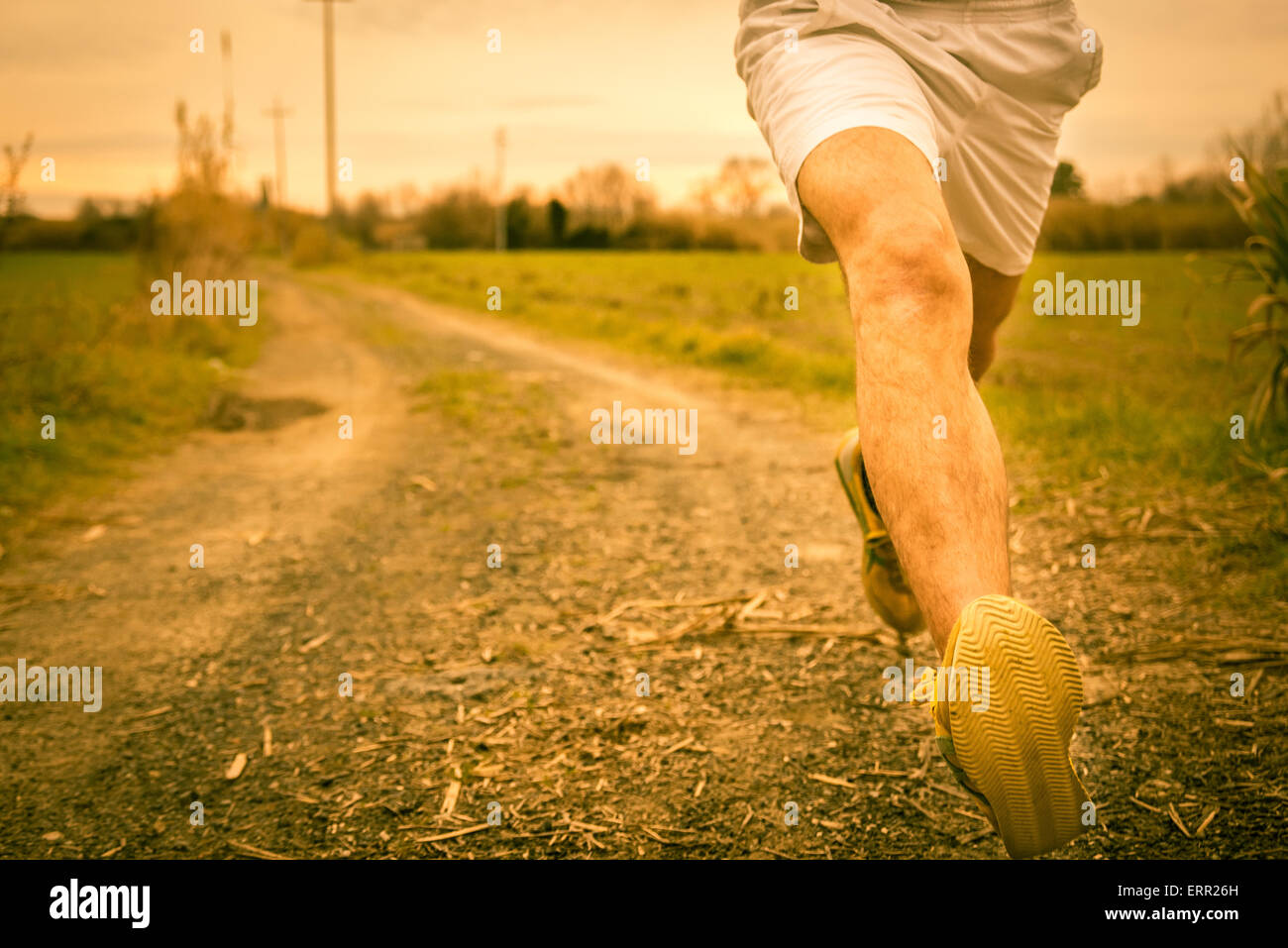 A guy running in the countryside Stock Photo - Alamy
