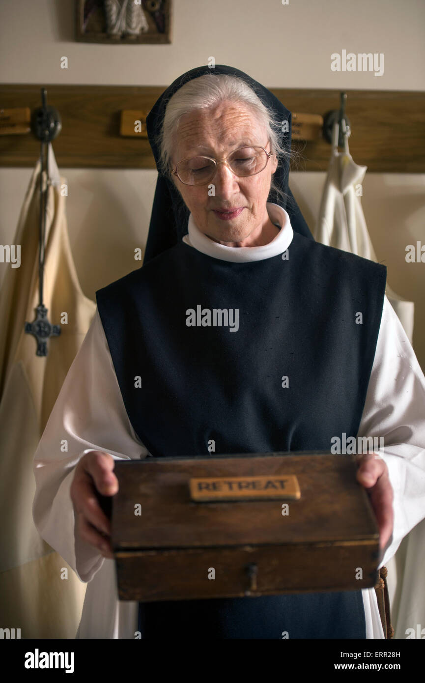 A Cistercian Nun with a box labelled ‘Retreat’ at Holy Cross Abbey near ...