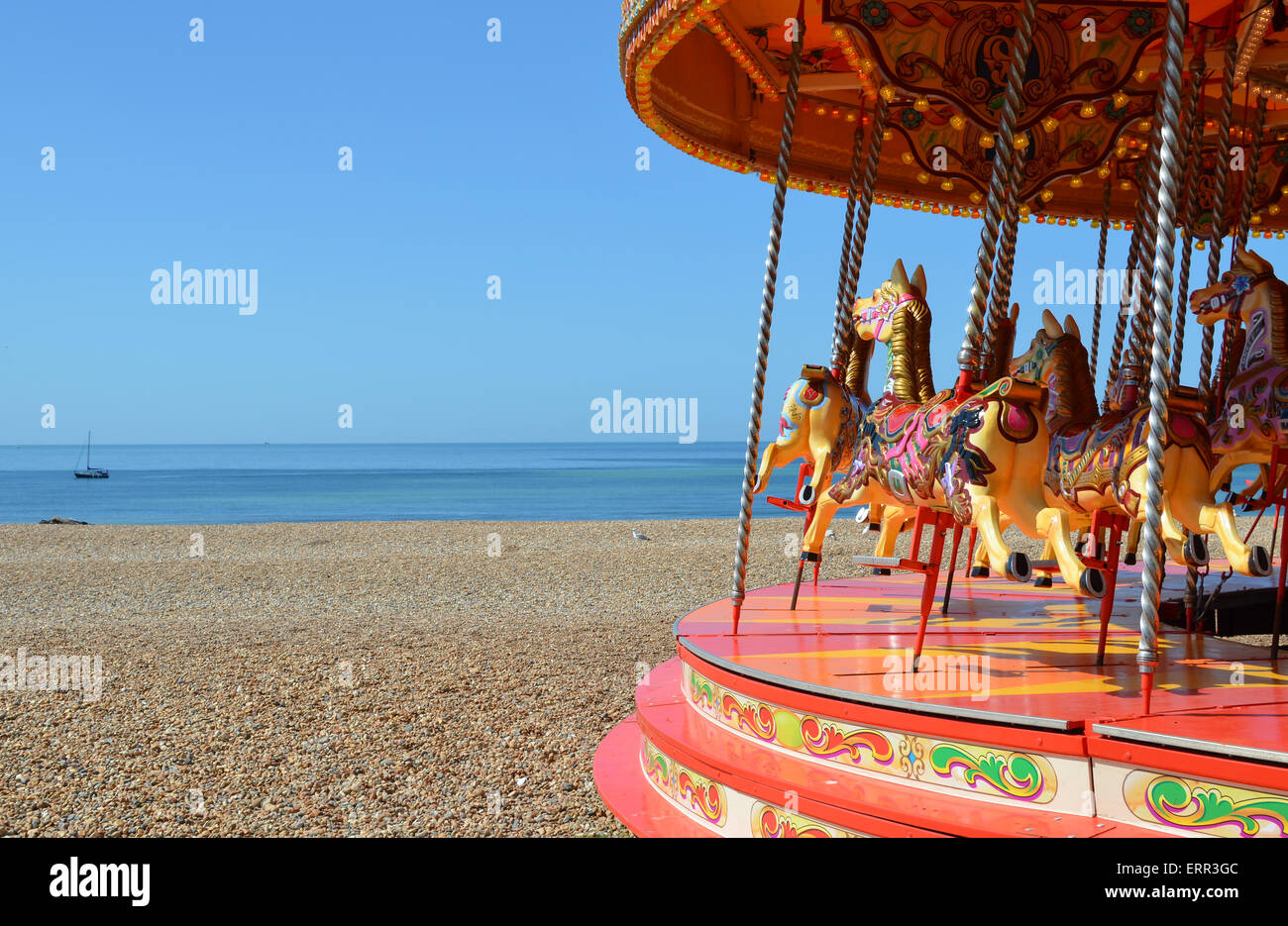 Traditional fairground carousel on Brighton seafront during Summer ...