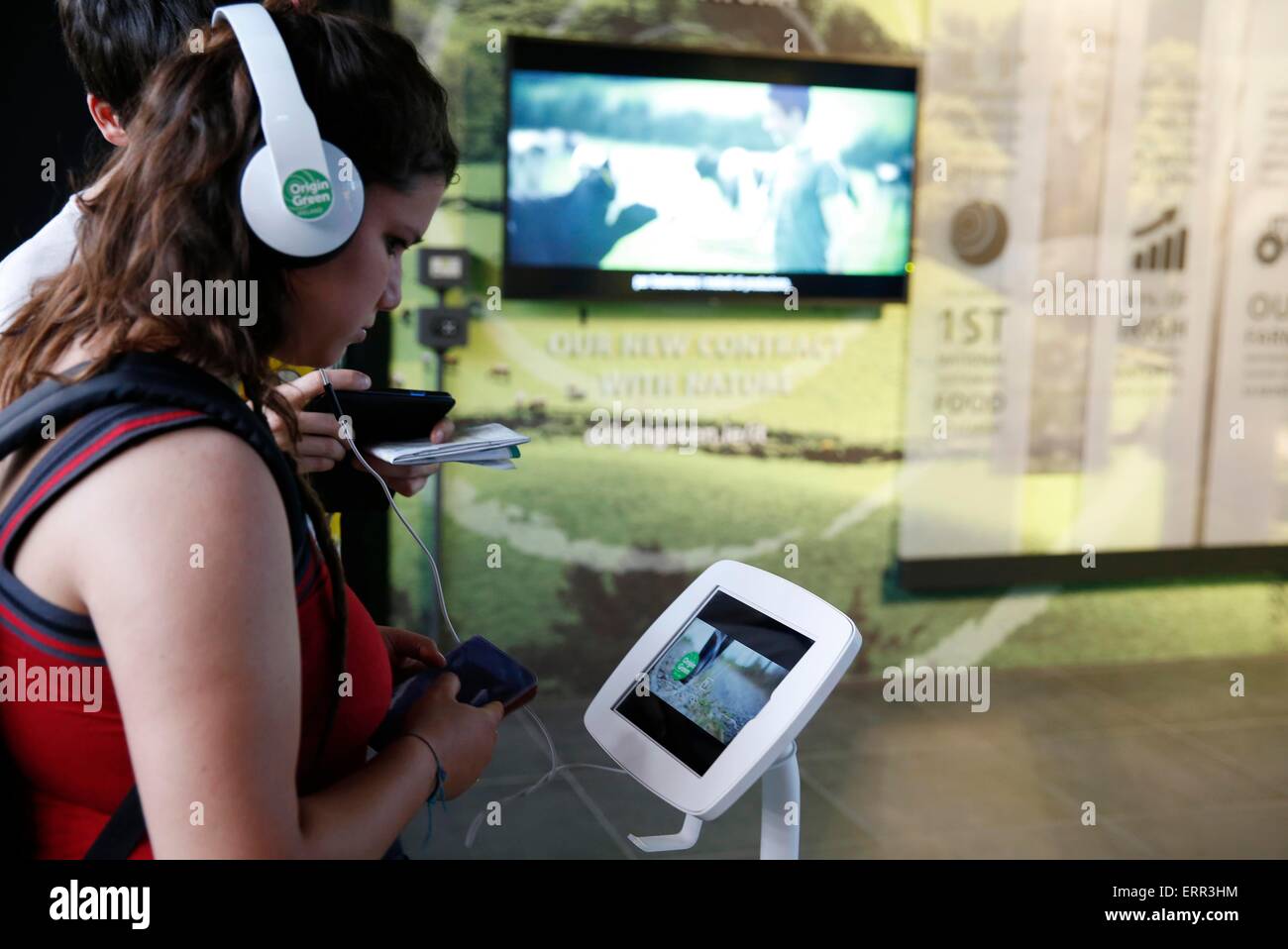 Milan, Italy. 7th June, 2015. A visitor uses a digital device to ...