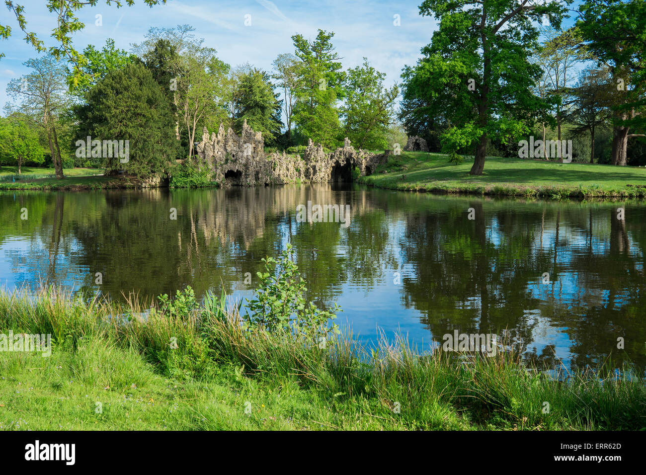 A lake and cave in a Surrey park Stock Photo - Alamy