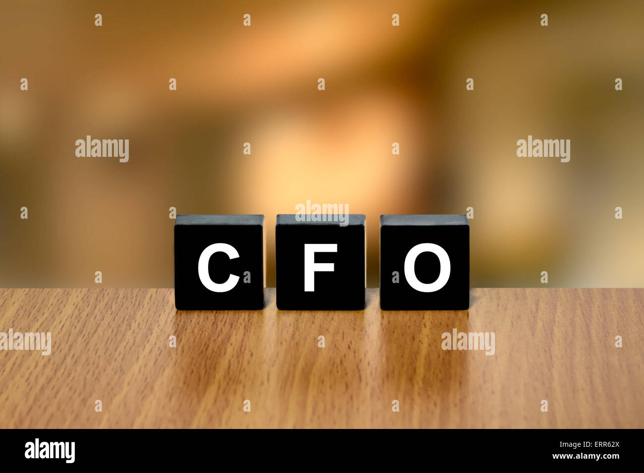 CFO or chief financial officer on black block with blurred background ...