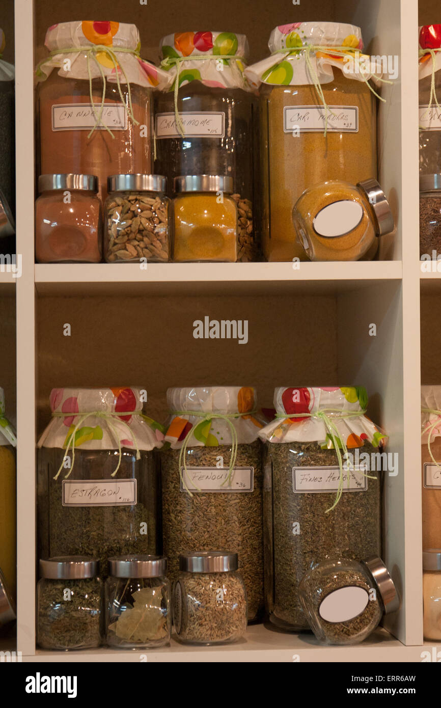 canned spices and herbs in individual glass barrel. Spices in glass ...
