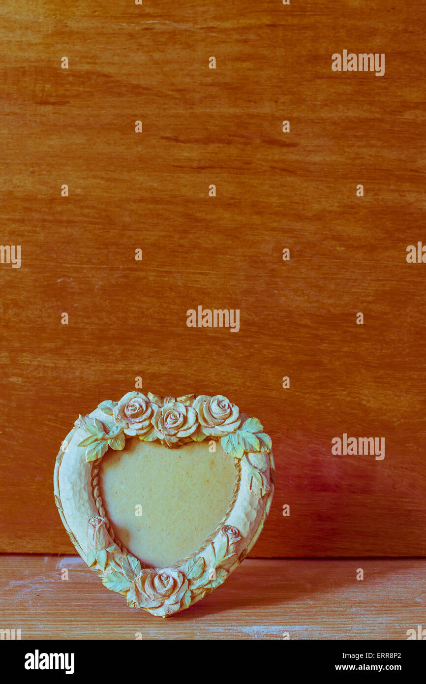 Heart Frame vintage on wooden floor Stock Photo - Alamy