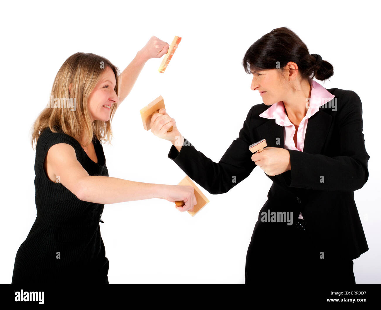 Two young business women fighting hi-res stock photography and images ...