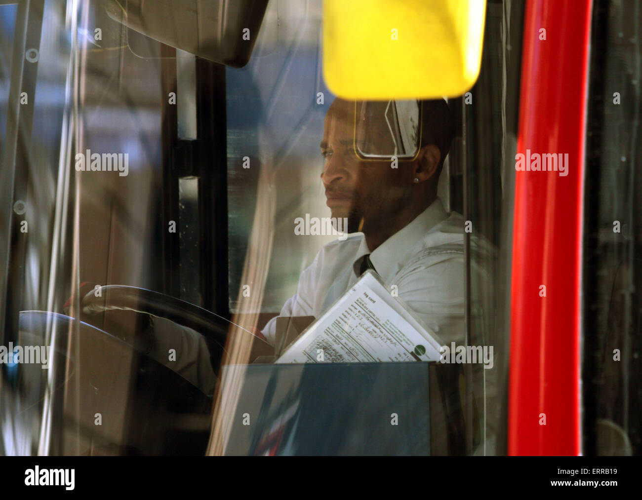 Bus driver London stuck in traffic jam driving red Stock Photo - Alamy