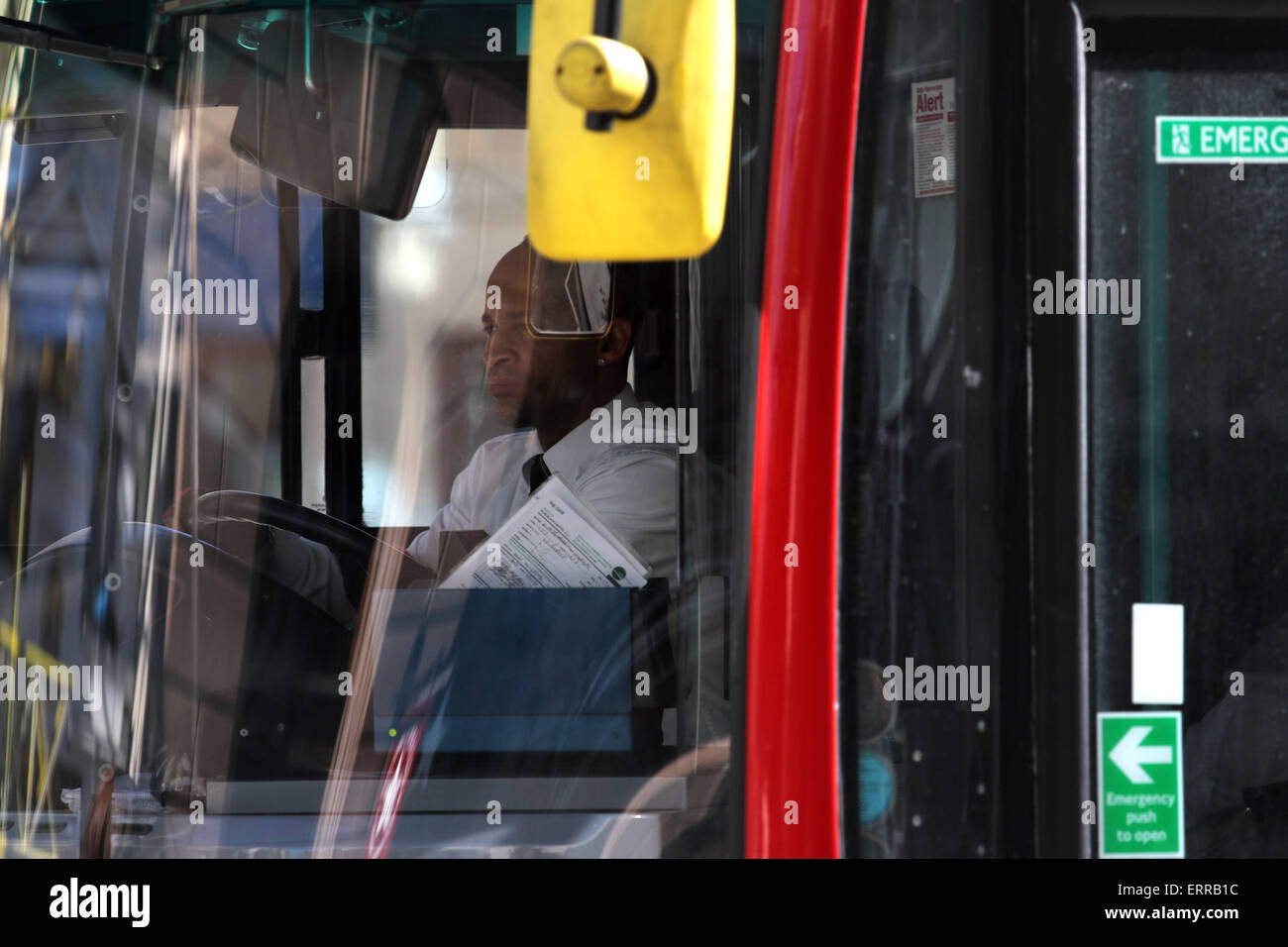 Bus driver London stuck in traffic jam driving red Stock Photo - Alamy