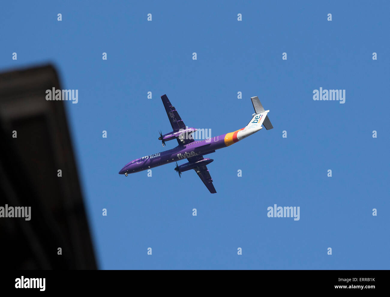 Flybe plane overhead blue sky getaway budget airline Stock Photo - Alamy