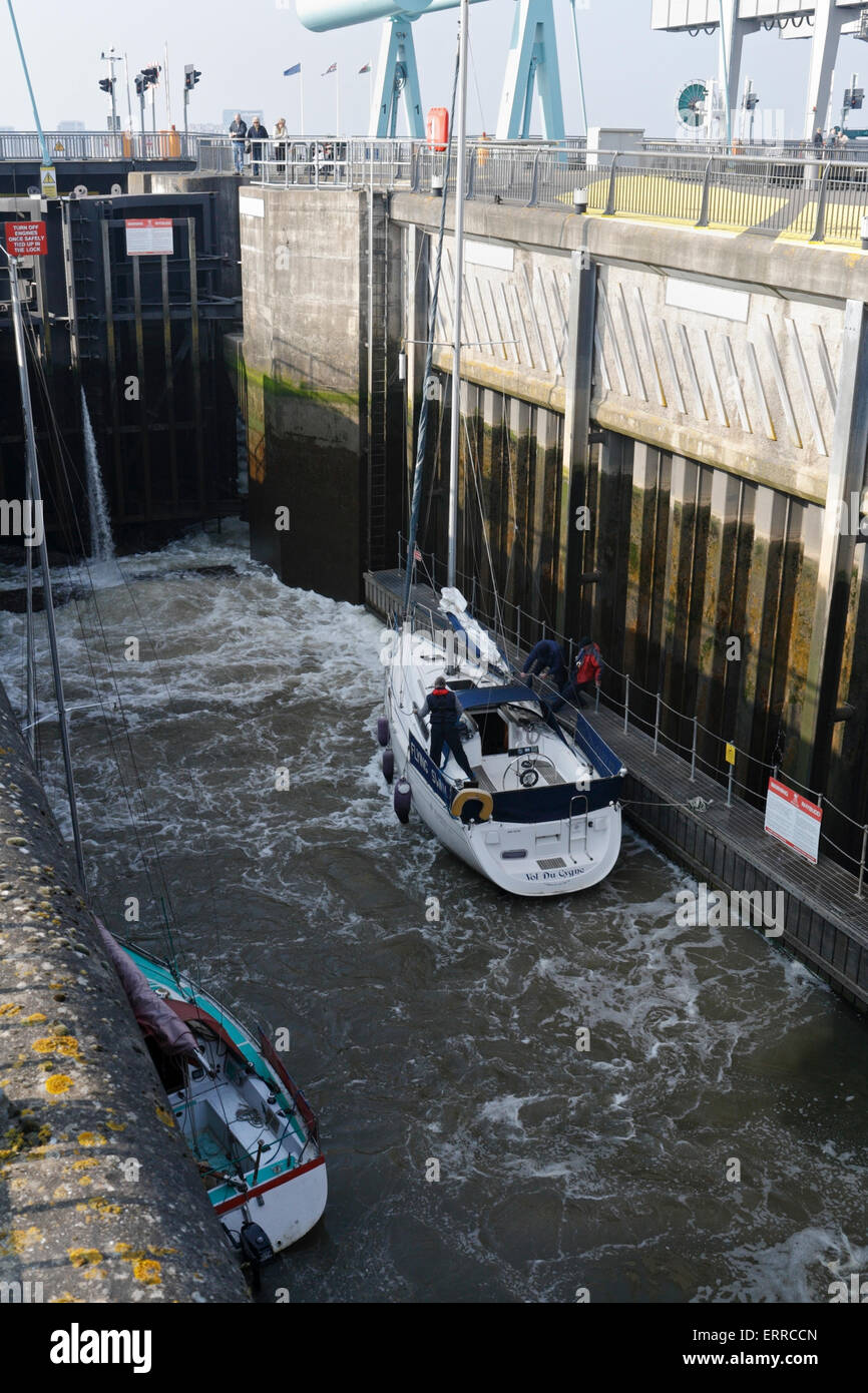 Sailing boat awaiting passage through the lock at Cardiff Bay Barrage ...