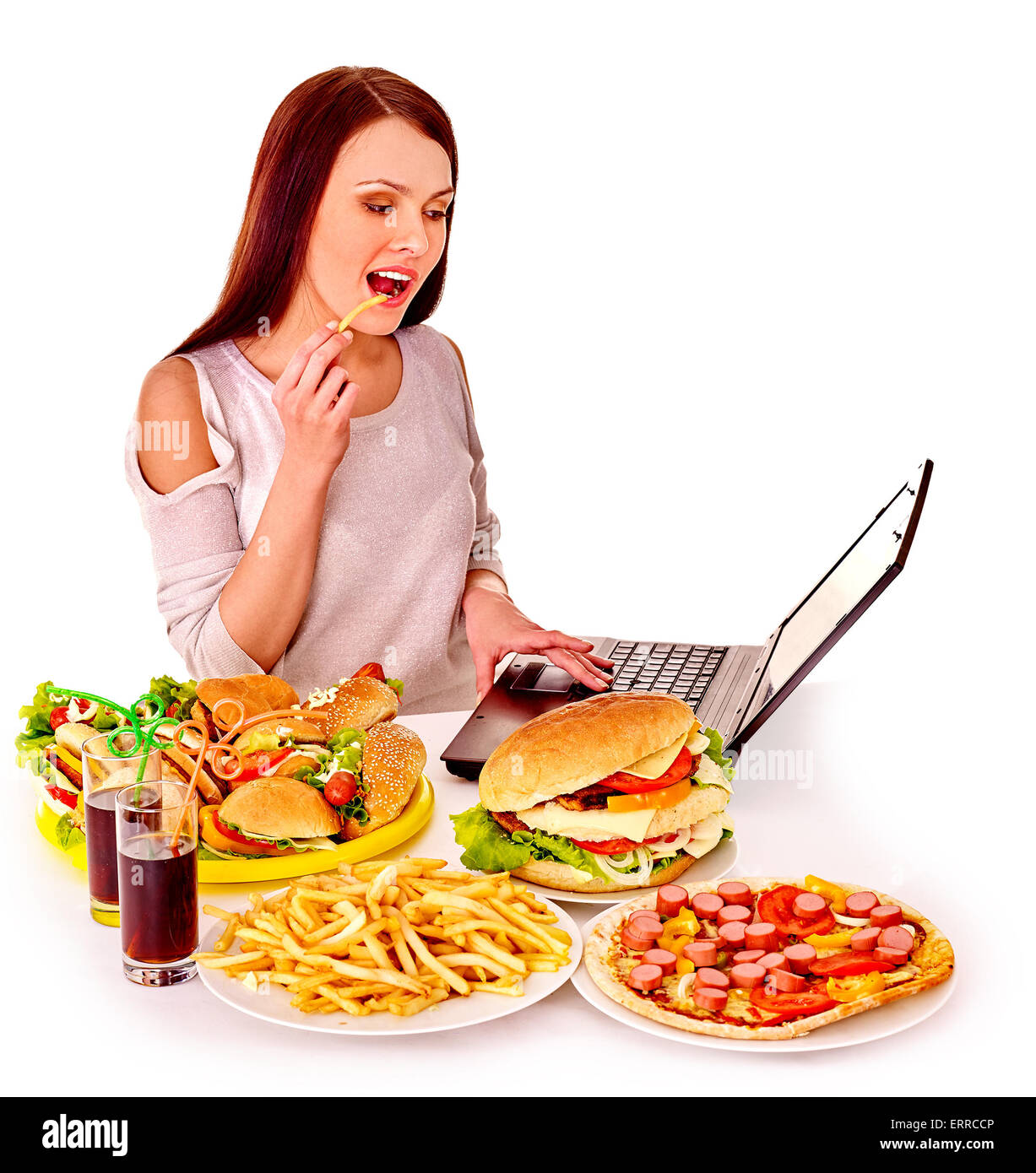 Woman eating junk food Stock Photo - Alamy