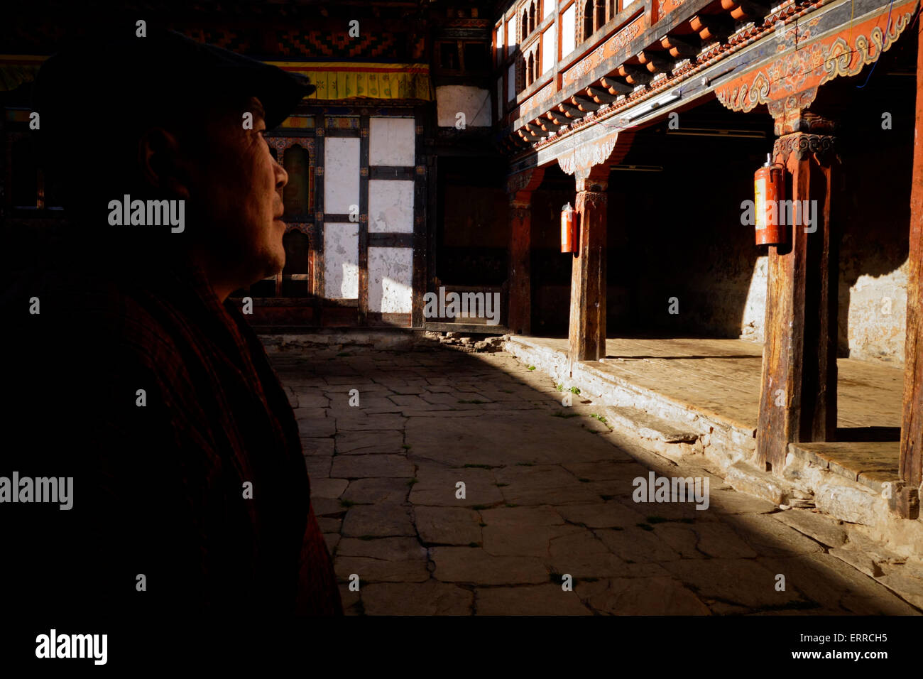 A Buddhist devotee at the courtyard of Tamshing Lakhang temple formally ...