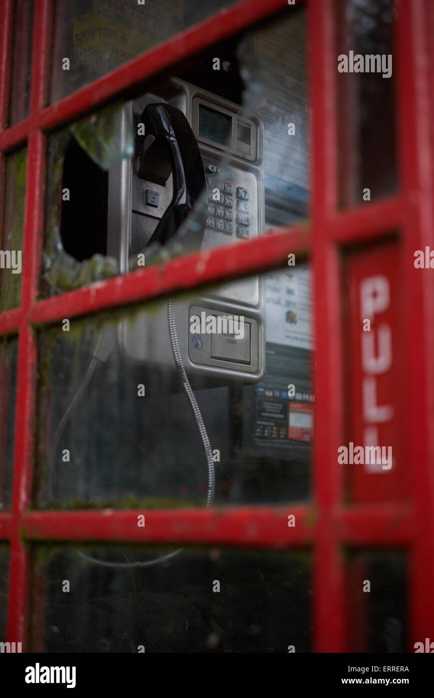 Through the broken window of a red telephone box Stock Photo - Alamy